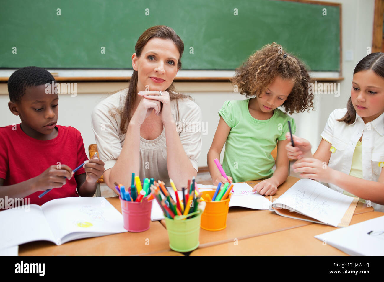 Teacher giving art class Stock Photo - Alamy