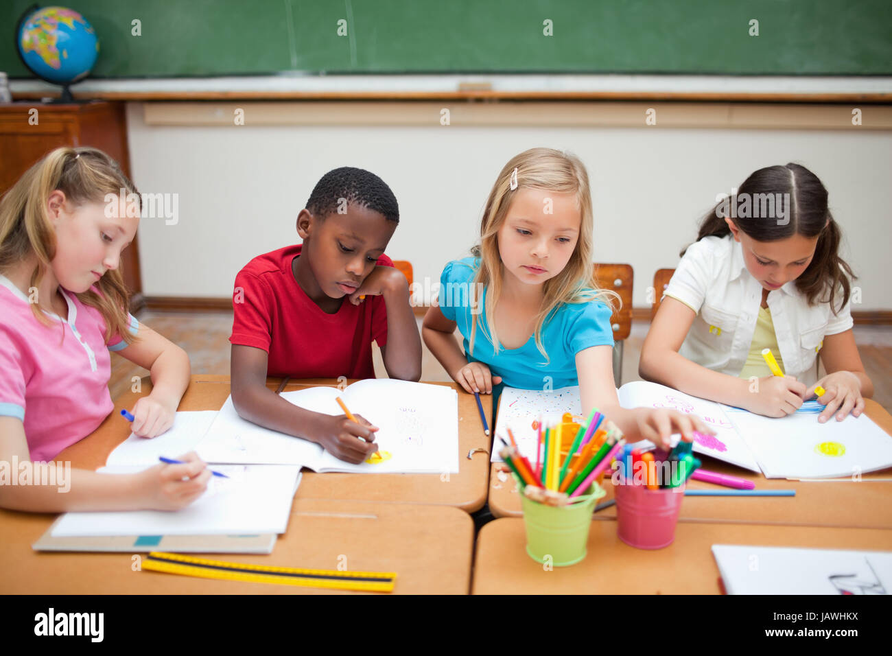 Students painting during art class Stock Photo - Alamy