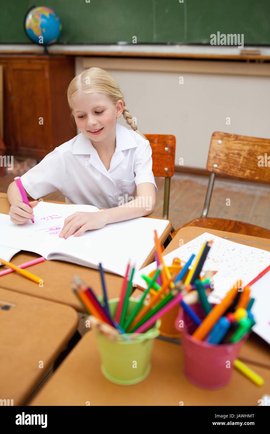 Little girl painting in school Stock Photo - Alamy