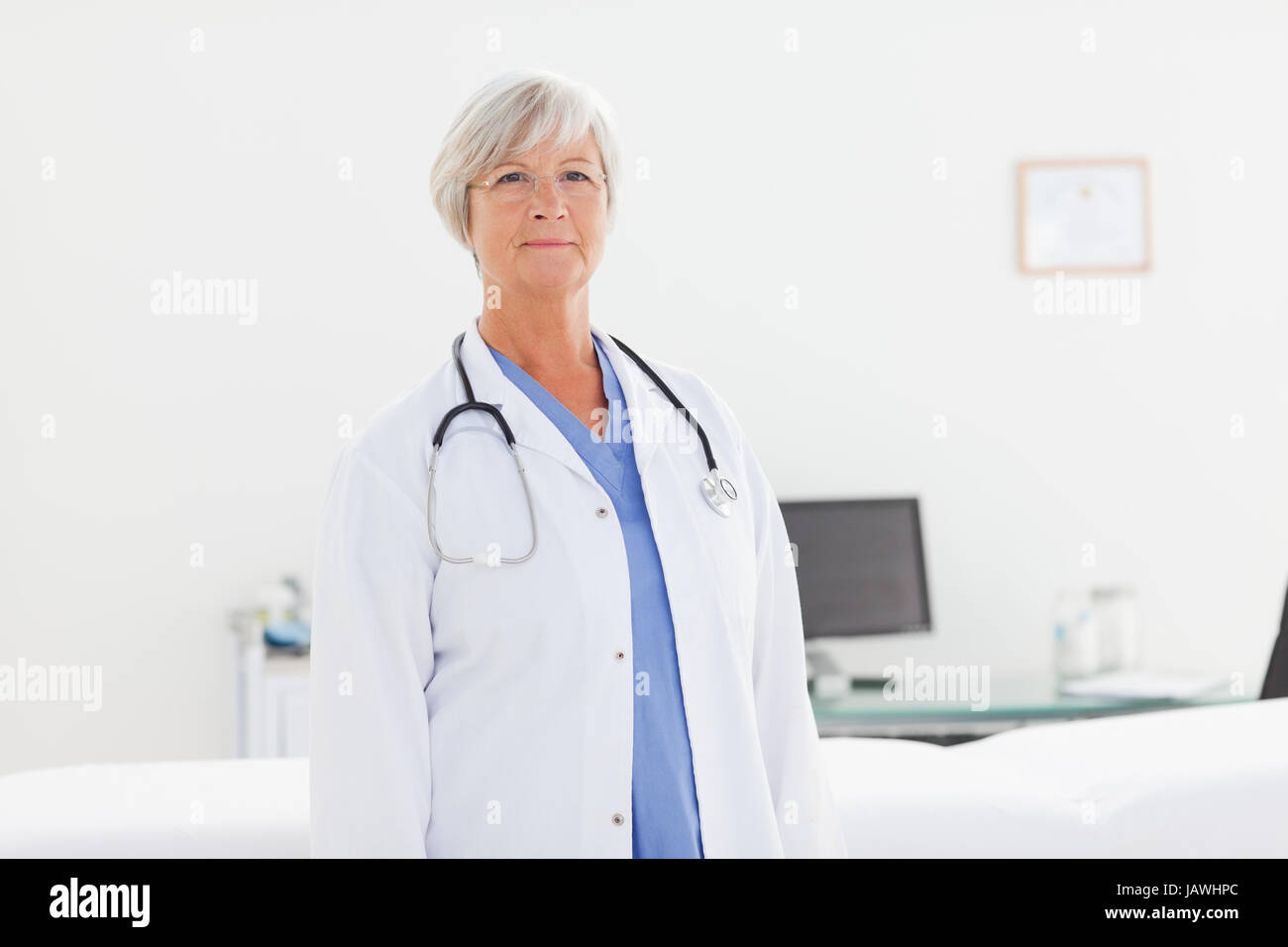 Doctor standing in her office Stock Photo - Alamy