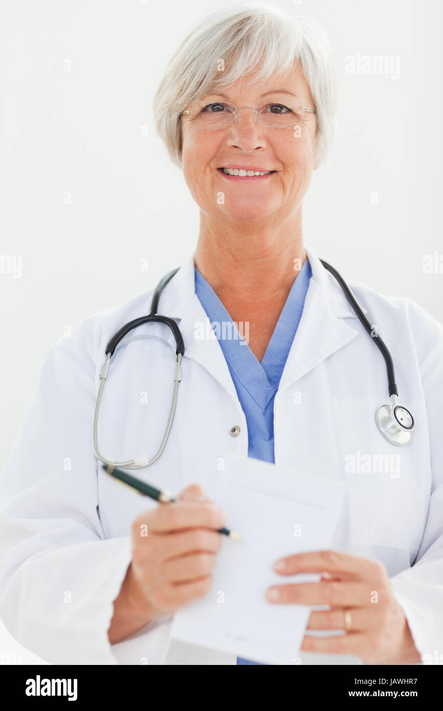 Doctor pointing prescription pad hi-res stock photography and images ...