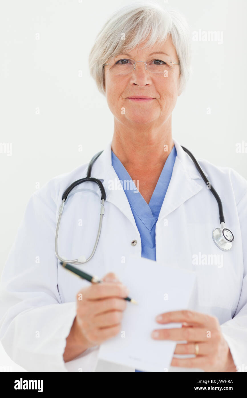 Doctor pointing prescription pad hi-res stock photography and images ...