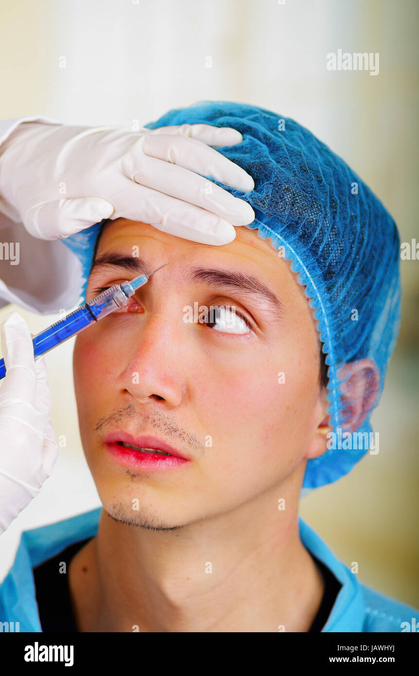 Man receiving botox injection hi-res stock photography and images - Alamy