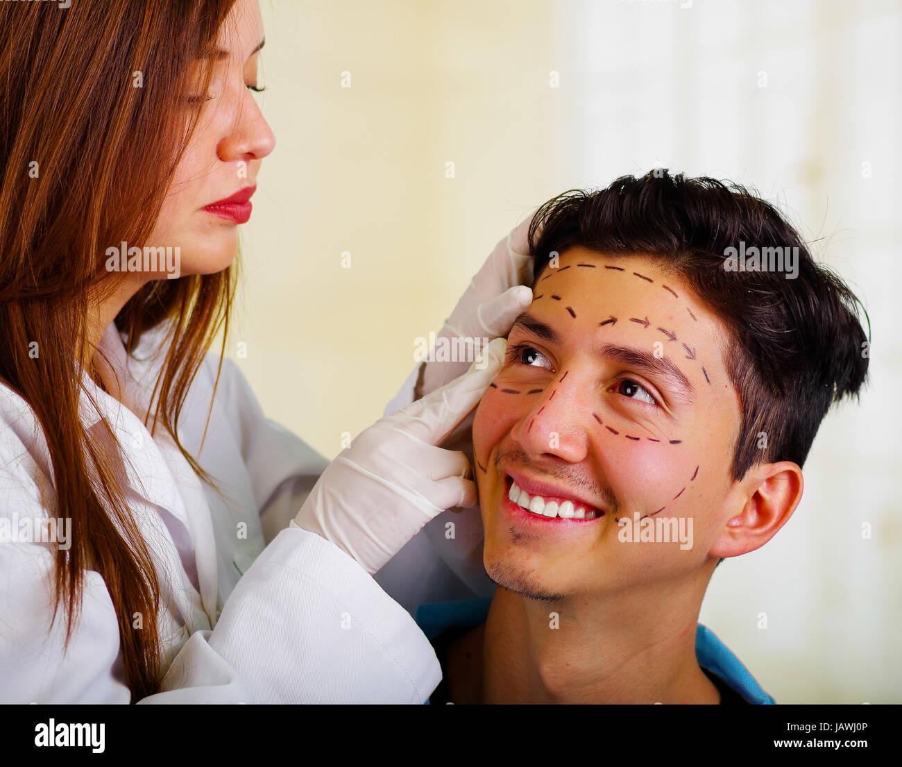 Closeup of a beautiful doctor touching patient s face of handsome young ...