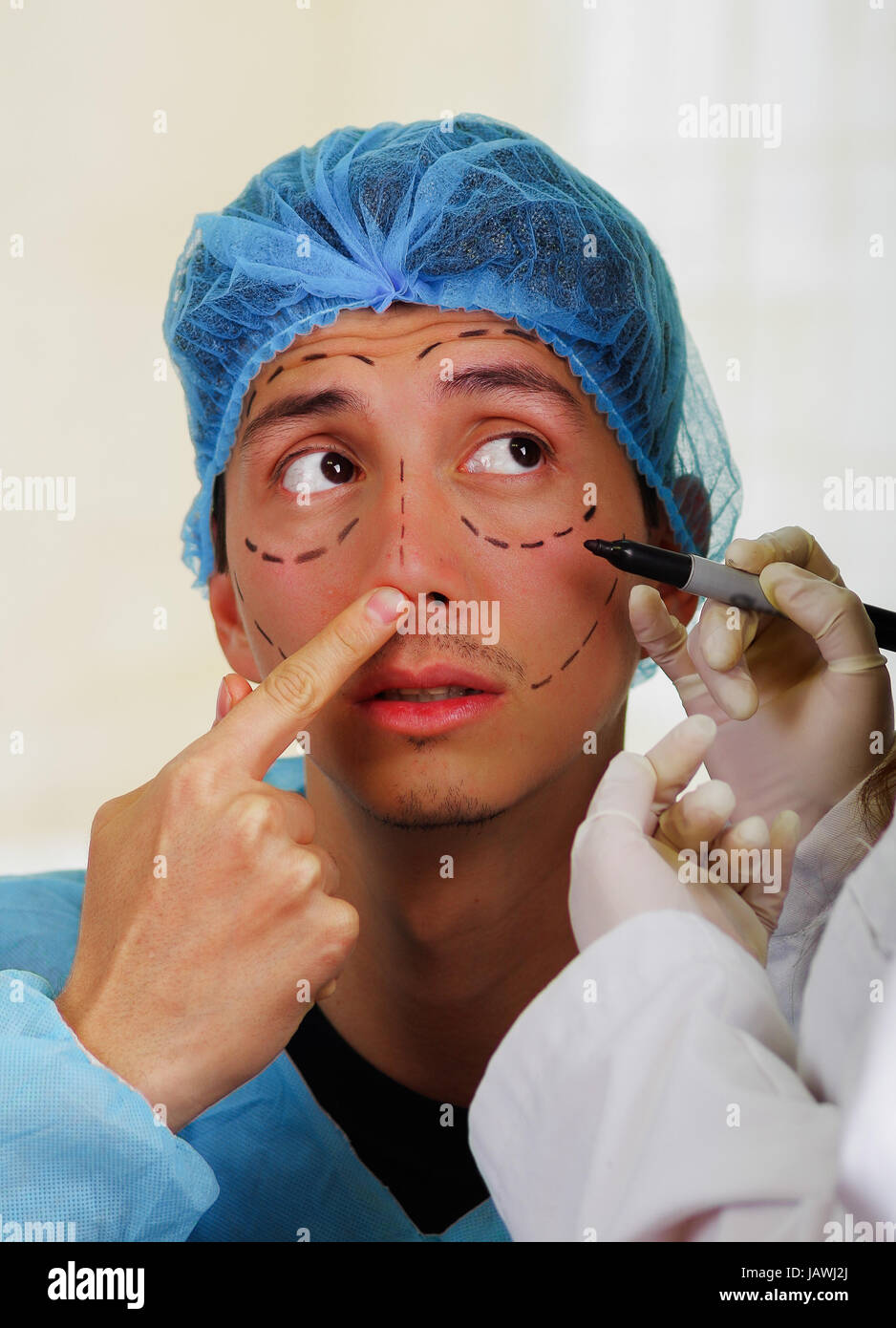 Man face surgery marks hi-res stock photography and images - Alamy