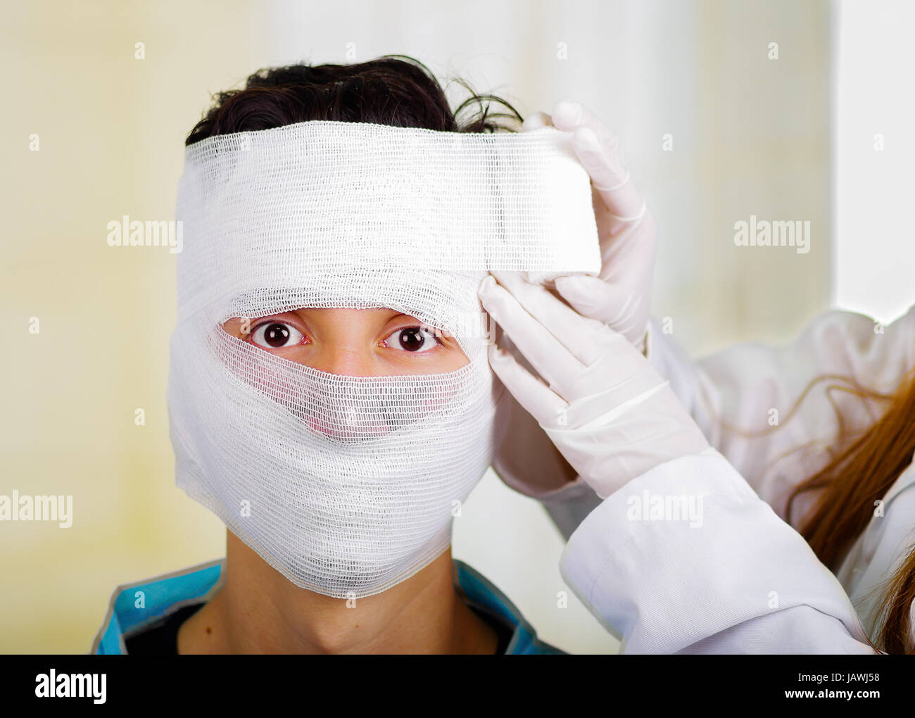 Doctor touching a men s head with trauma in his head and elastic ...