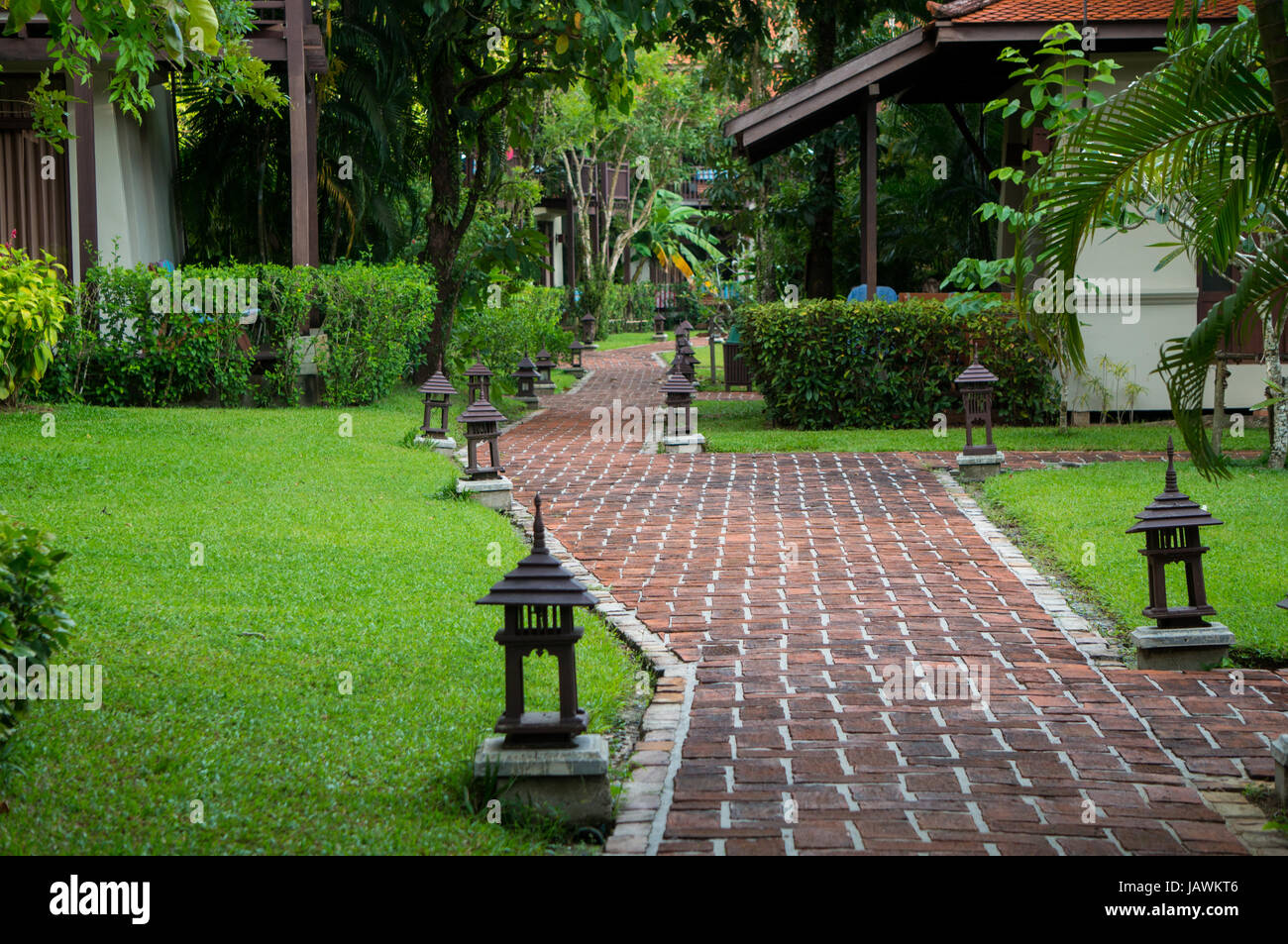 Path through resort garden Stock Photo - Alamy
