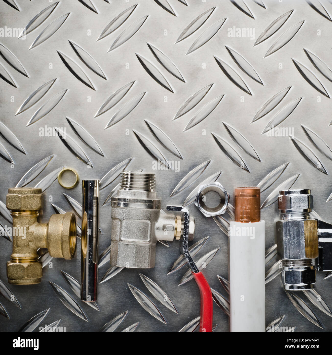 Plumbing inlet pipe valve on a metal surface Stock Photo - Alamy