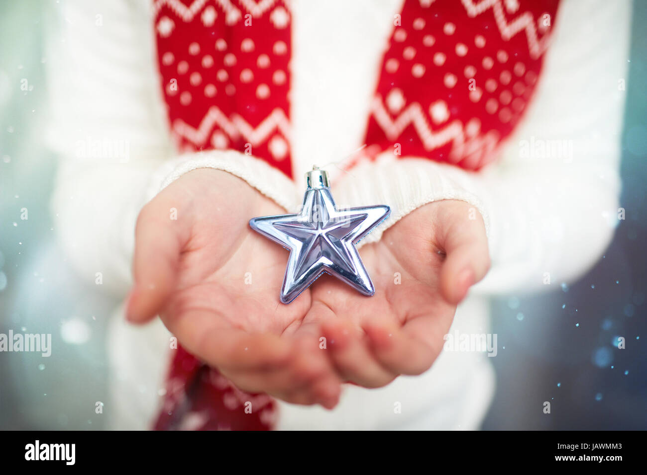 Image of decorative silver toy star on female hands Stock Photo - Alamy