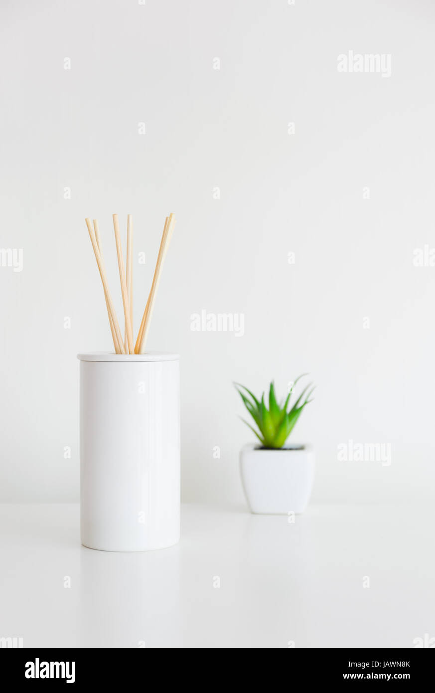 House perfume scent diffuser and green plant Stock Photo - Alamy