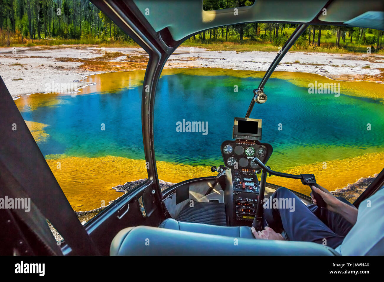 Helicopter cockpit with pilot arm and control console inside the cabin ...