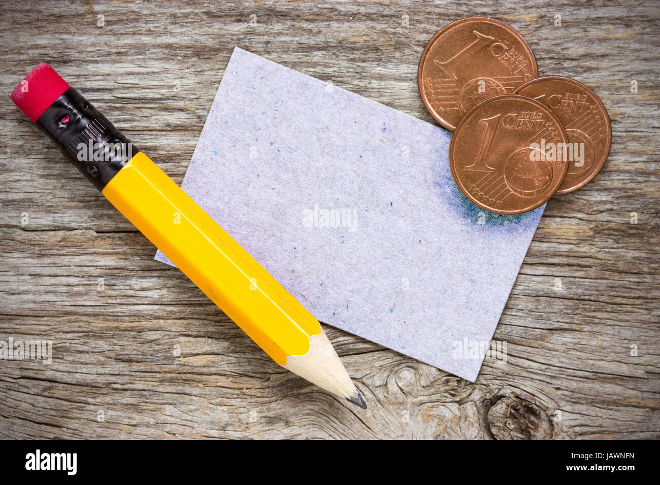 Copper euro cents with pencil and paper card Stock Photo - Alamy