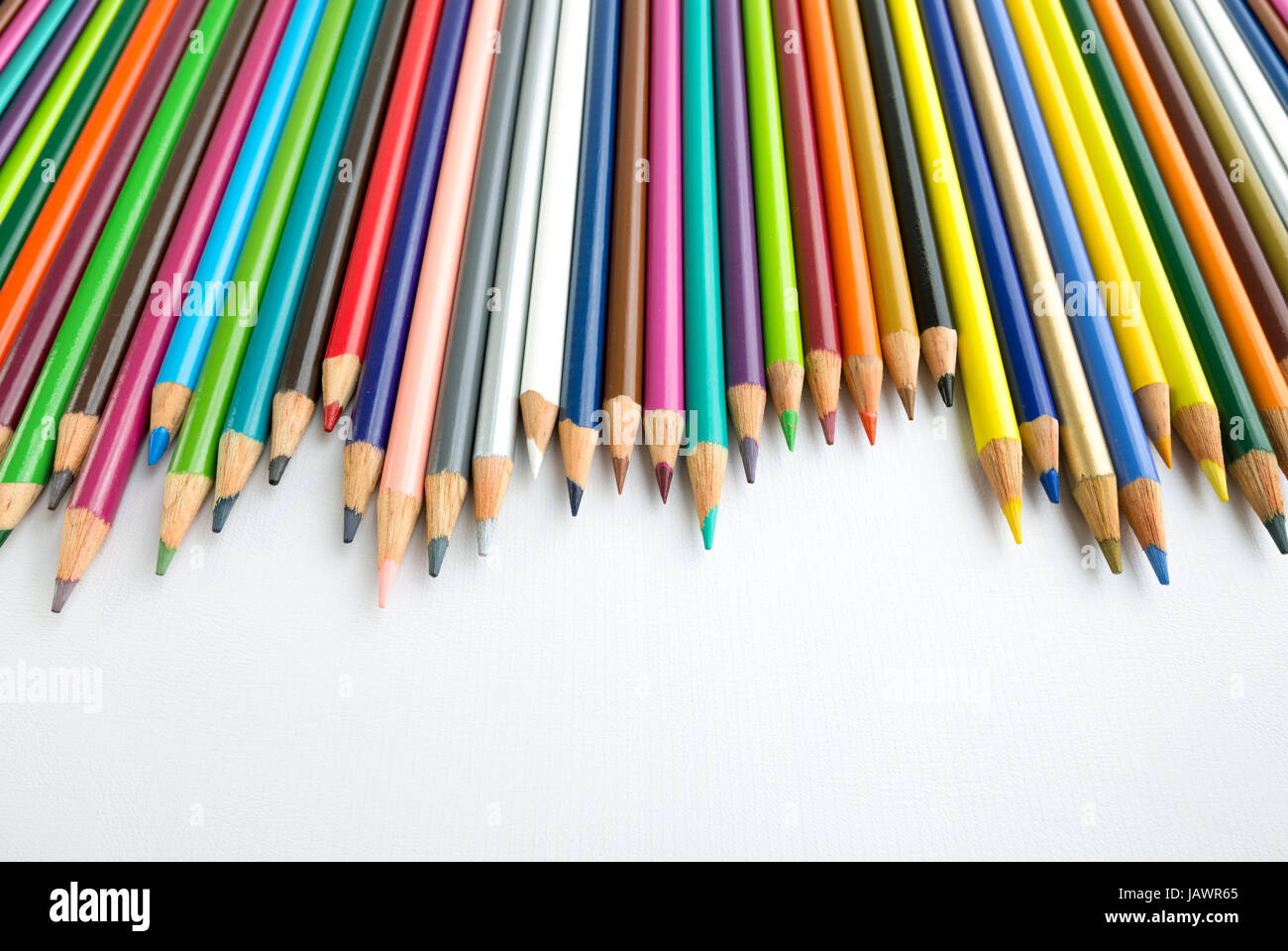 Several colored pencils lined up forming a graph Stock Photo - Alamy