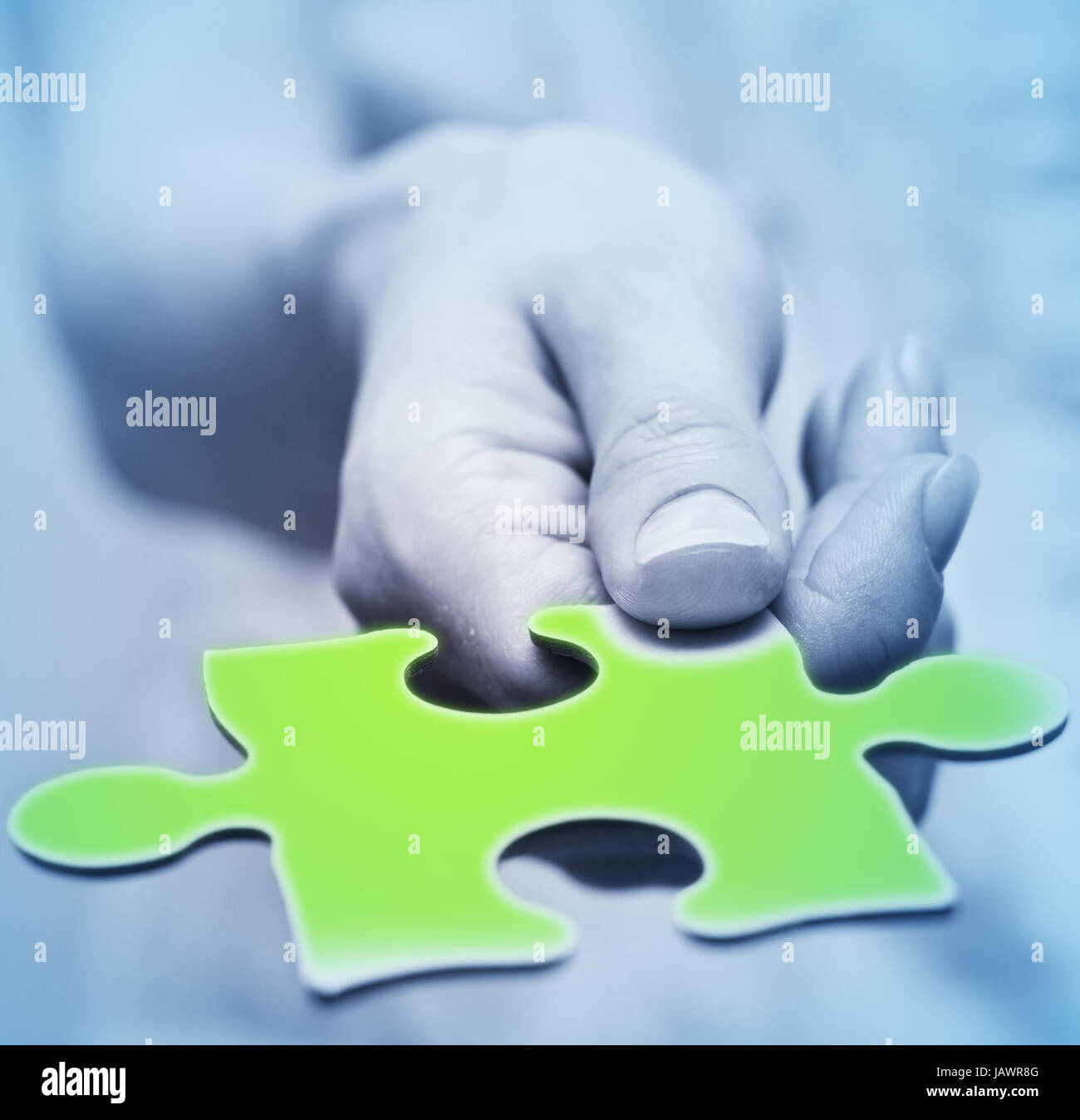 Human hands holding the missing piece Stock Photo - Alamy