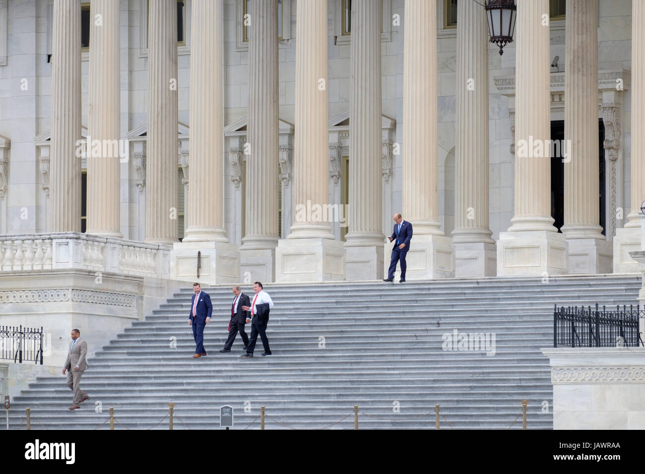 People walking down the steps on the House side of the U.S. Capitol ...