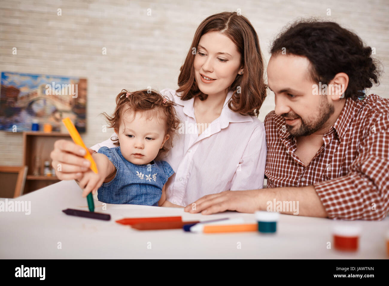 Happy Family Playing with Child at Home Stock Photo - Alamy