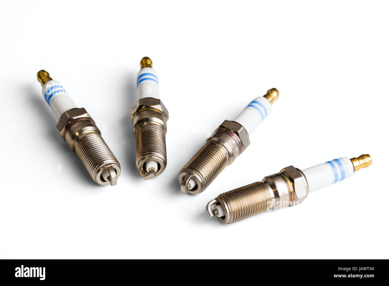 Spark plugs isolated on white background Stock Photo - Alamy