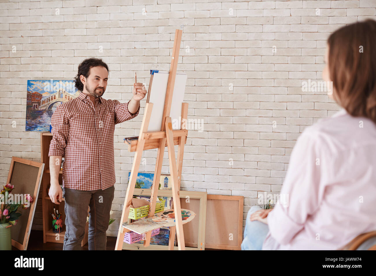 Artist Painting Portrait of Model in Art-Studio Stock Photo - Alamy