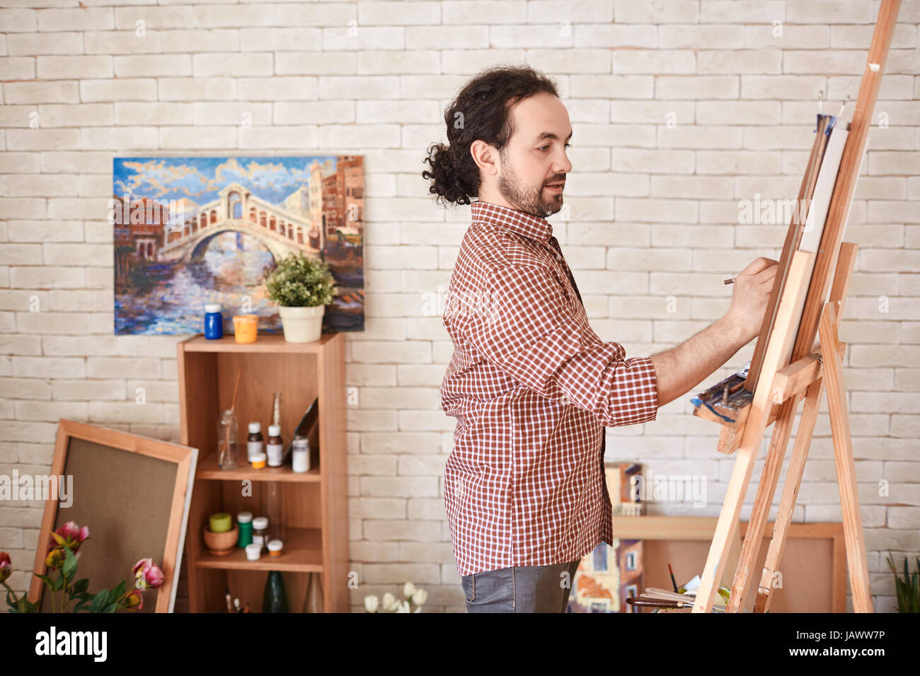 Focused hispanic man in studio hi-res stock photography and images - Alamy