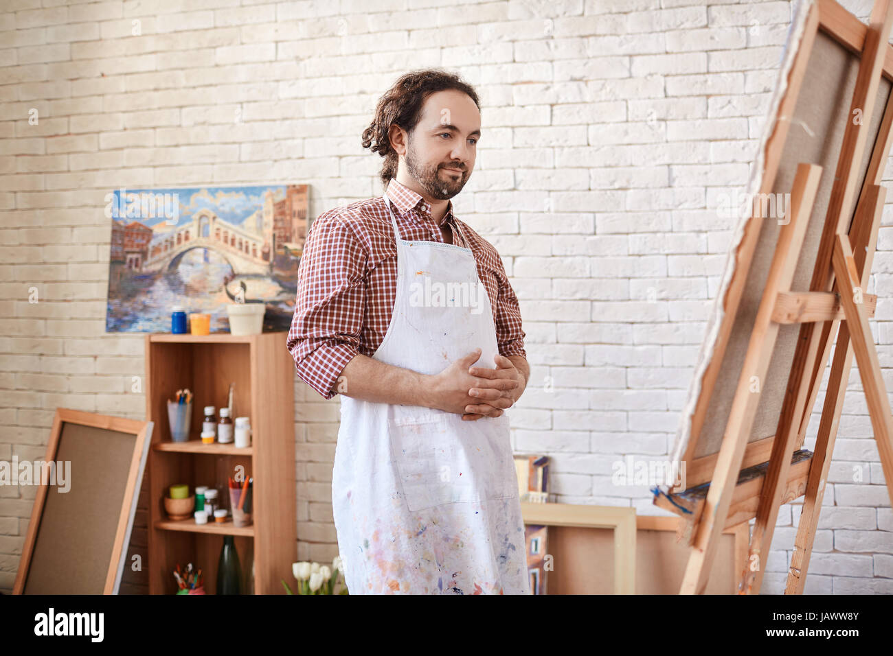 Pleased Artists Looking at finished painting in Art-Studio Stock Photo ...