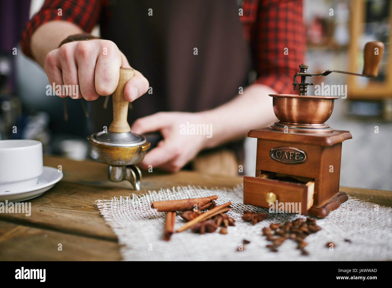 Old-Fashioned barista Making Cinnamon Coffee Stock Photo - Alamy