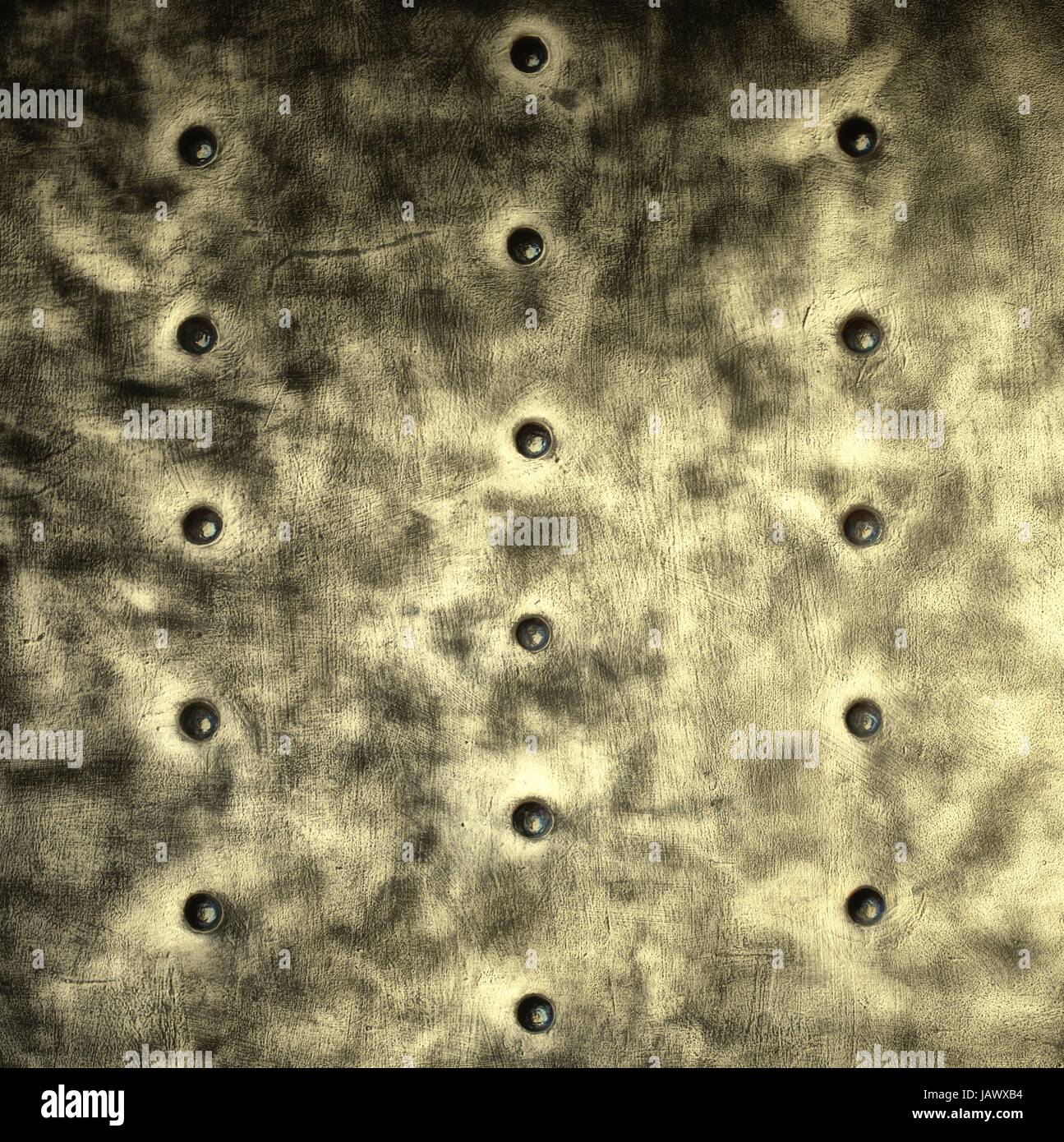 Closeup of grunge gray grey metal plate with rivets and screws as ...