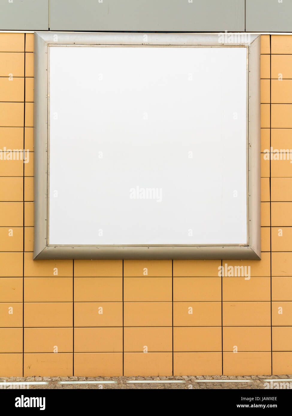 Empty blank square white advertising billboard on orange tiled wall ...