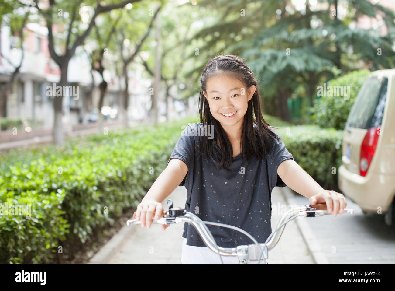 Chinese girl bike 11 years hi-res stock photography and images - Alamy