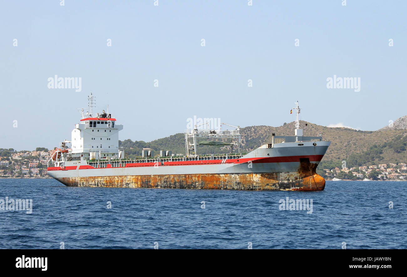 Side view of old cargo ship with rusting hull Stock Photo - Alamy