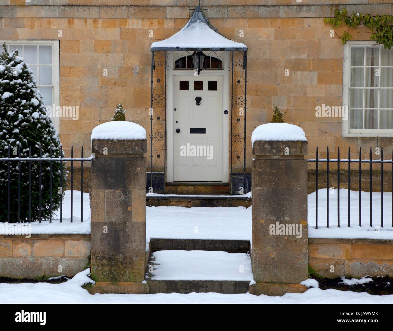 Cotswold house doorway in snow, Broadway, Worcestershire, England Stock ...