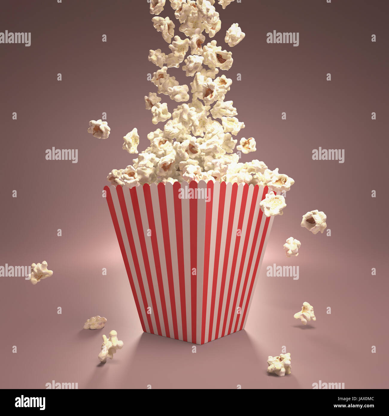 Dropping popcorn in striped classic package Stock Photo - Alamy