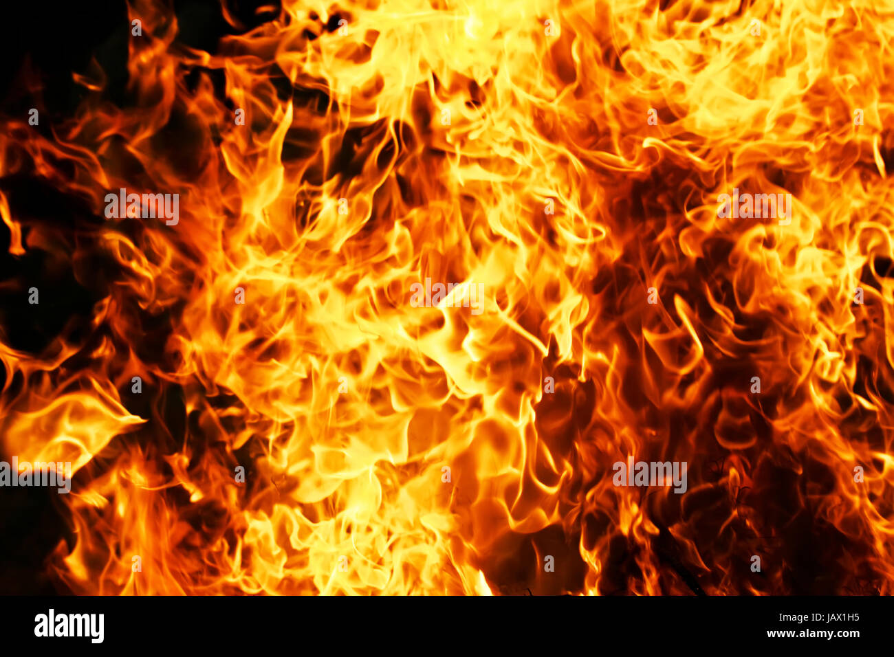 Beautiful yellow and orange hot fire on black background Stock Photo ...