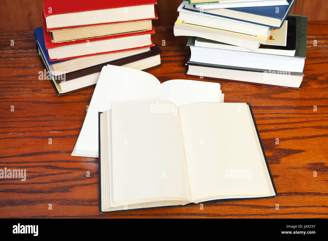 Opened book on top of stack of books hi-res stock photography and ...