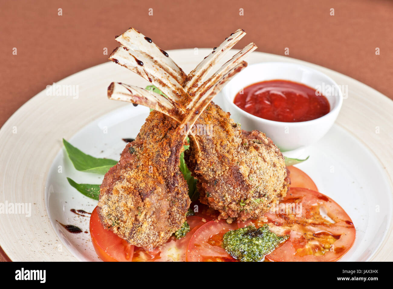 roasted lamb rib chops with vegetables Stock Photo - Alamy