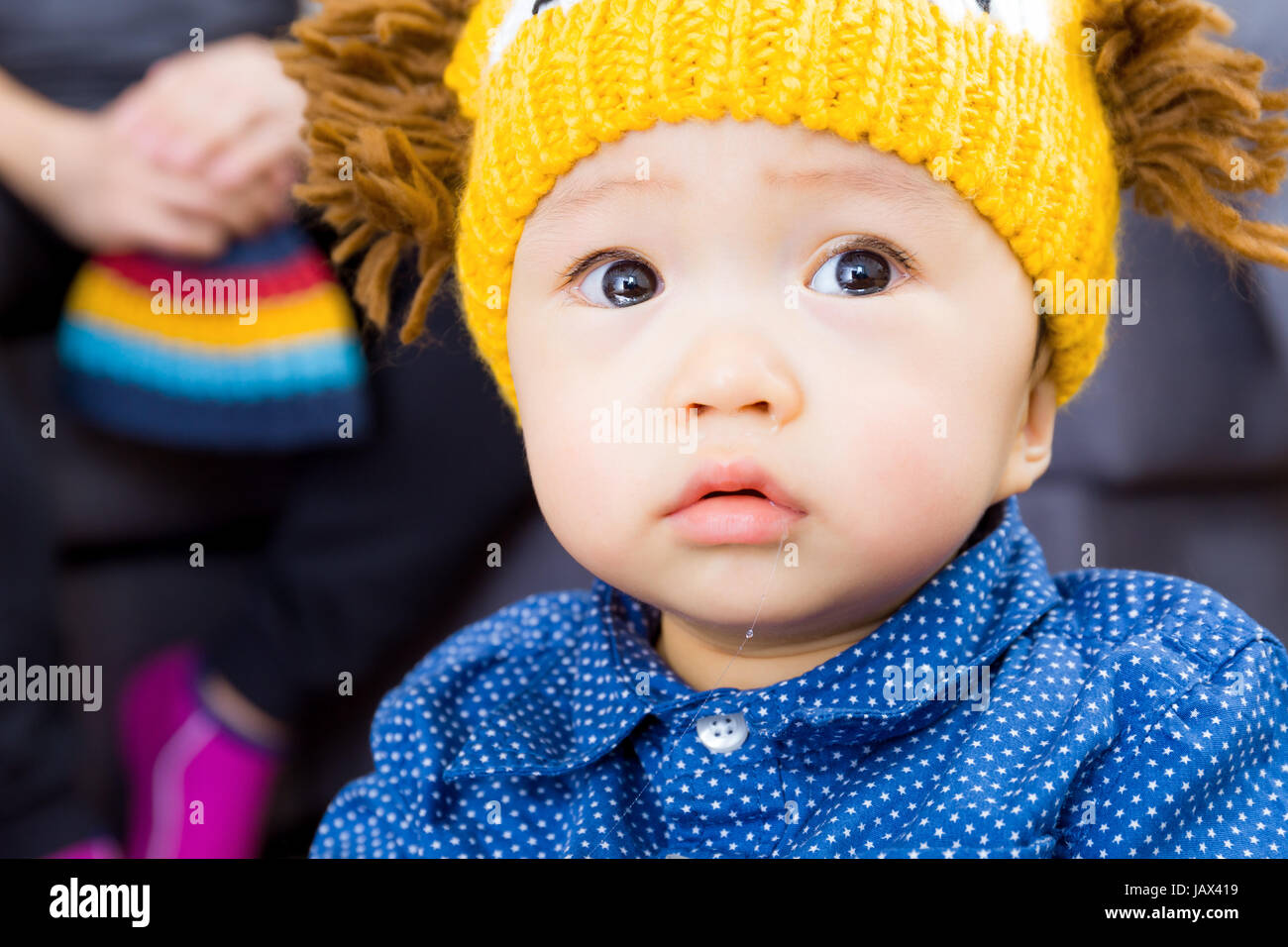 Asian baby boy feeling sad Stock Photo - Alamy