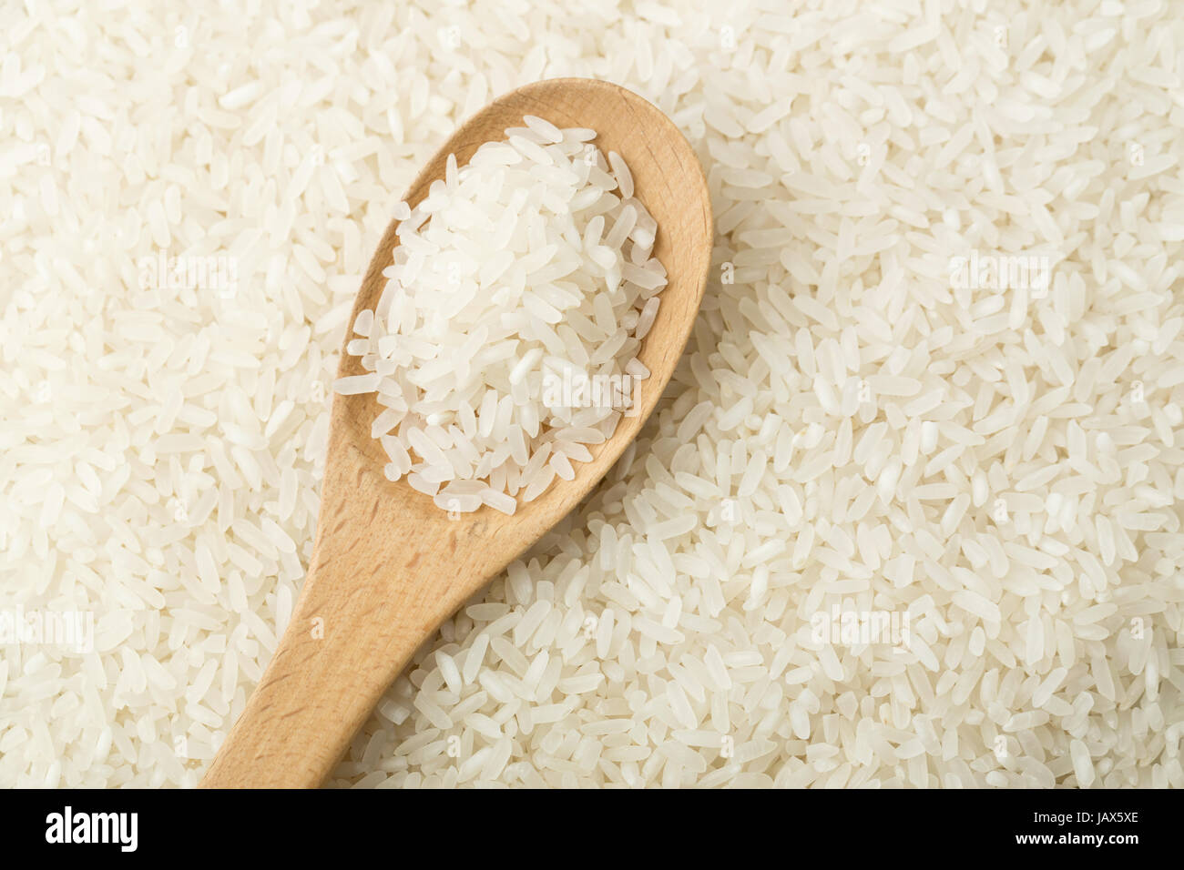 White rice on teaspoon Stock Photo - Alamy