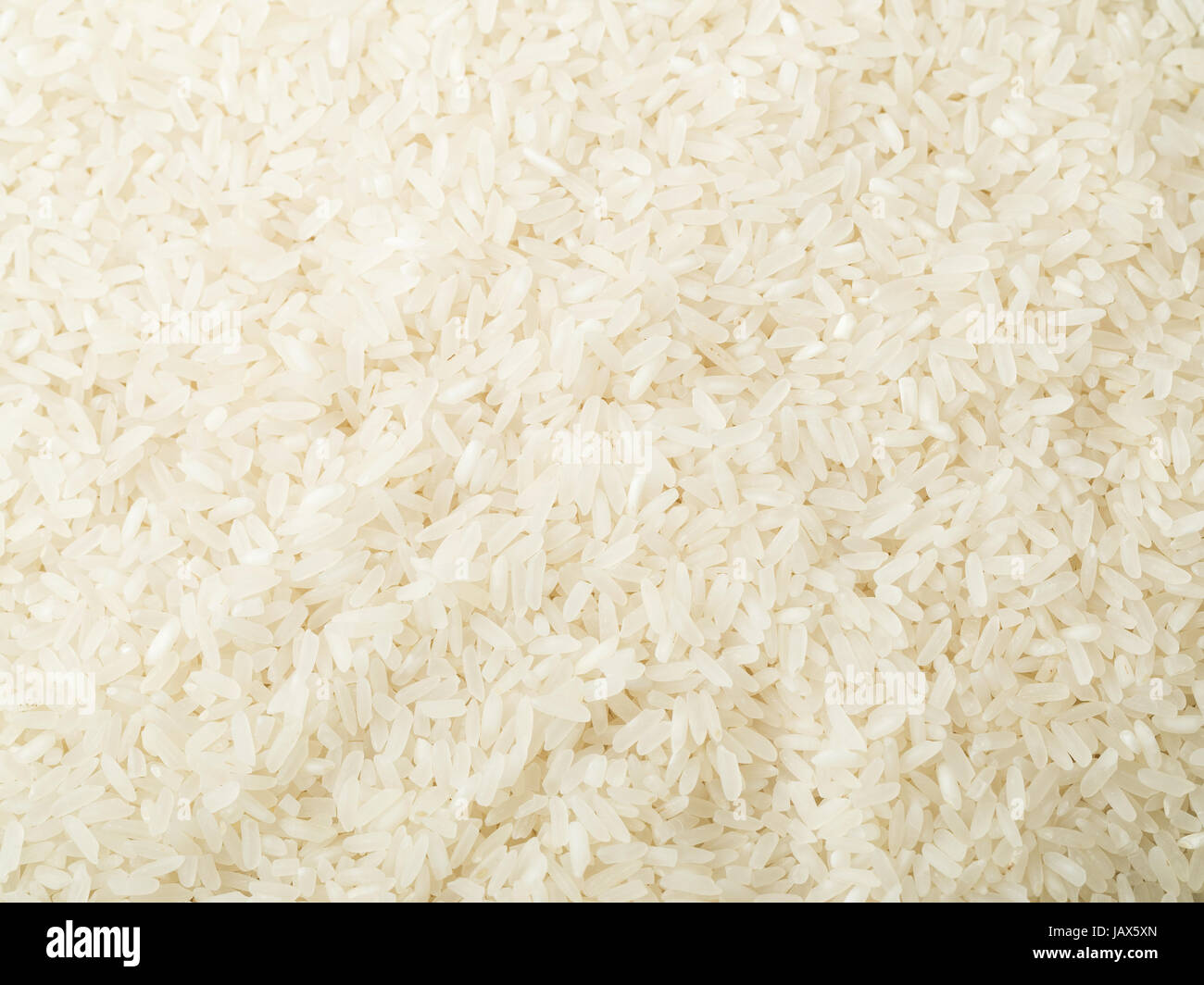 Uncooked white rice Stock Photo - Alamy