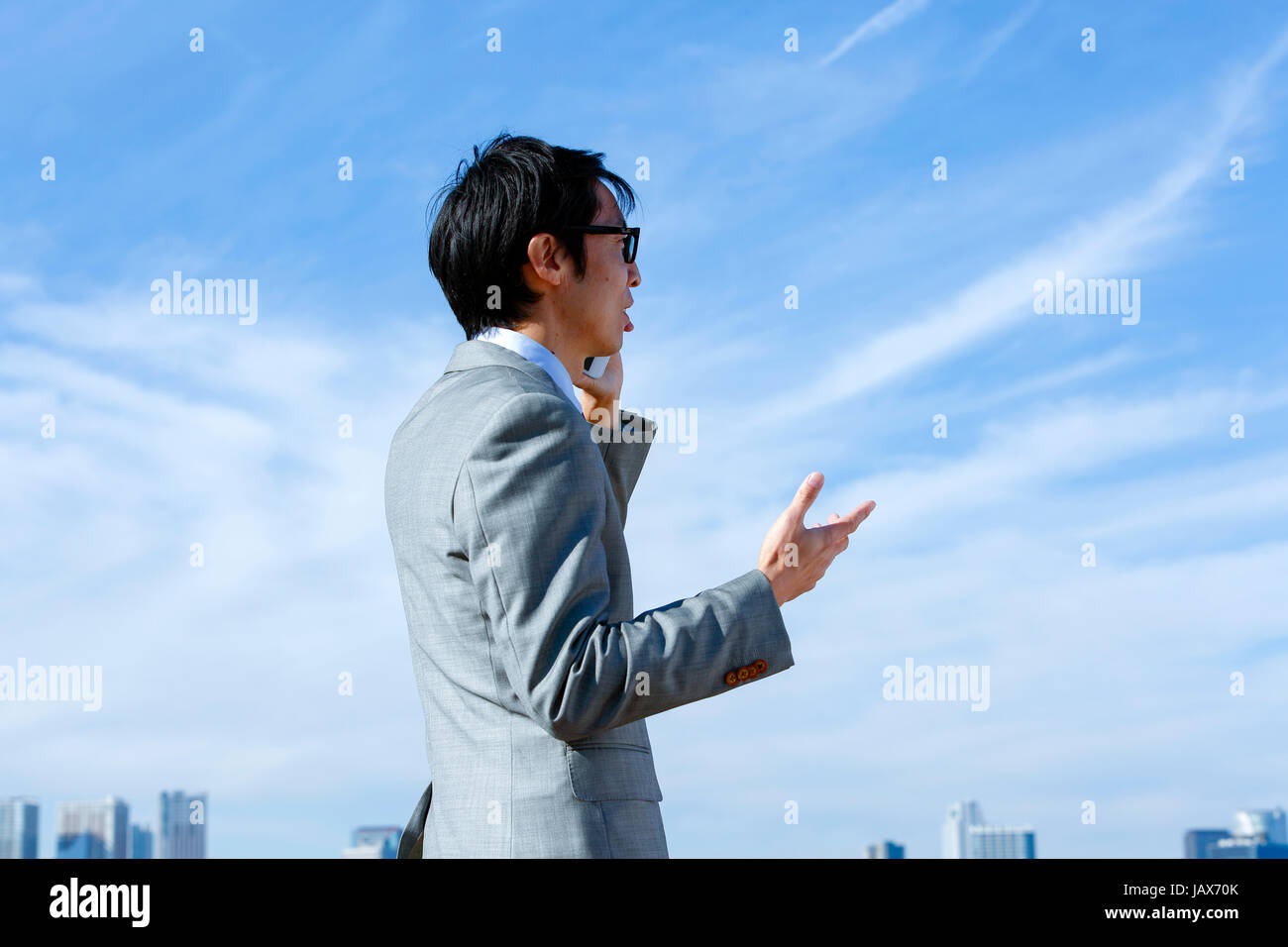 Japanese businessman on the phone downtown Tokyo, Japan Stock Photo - Alamy