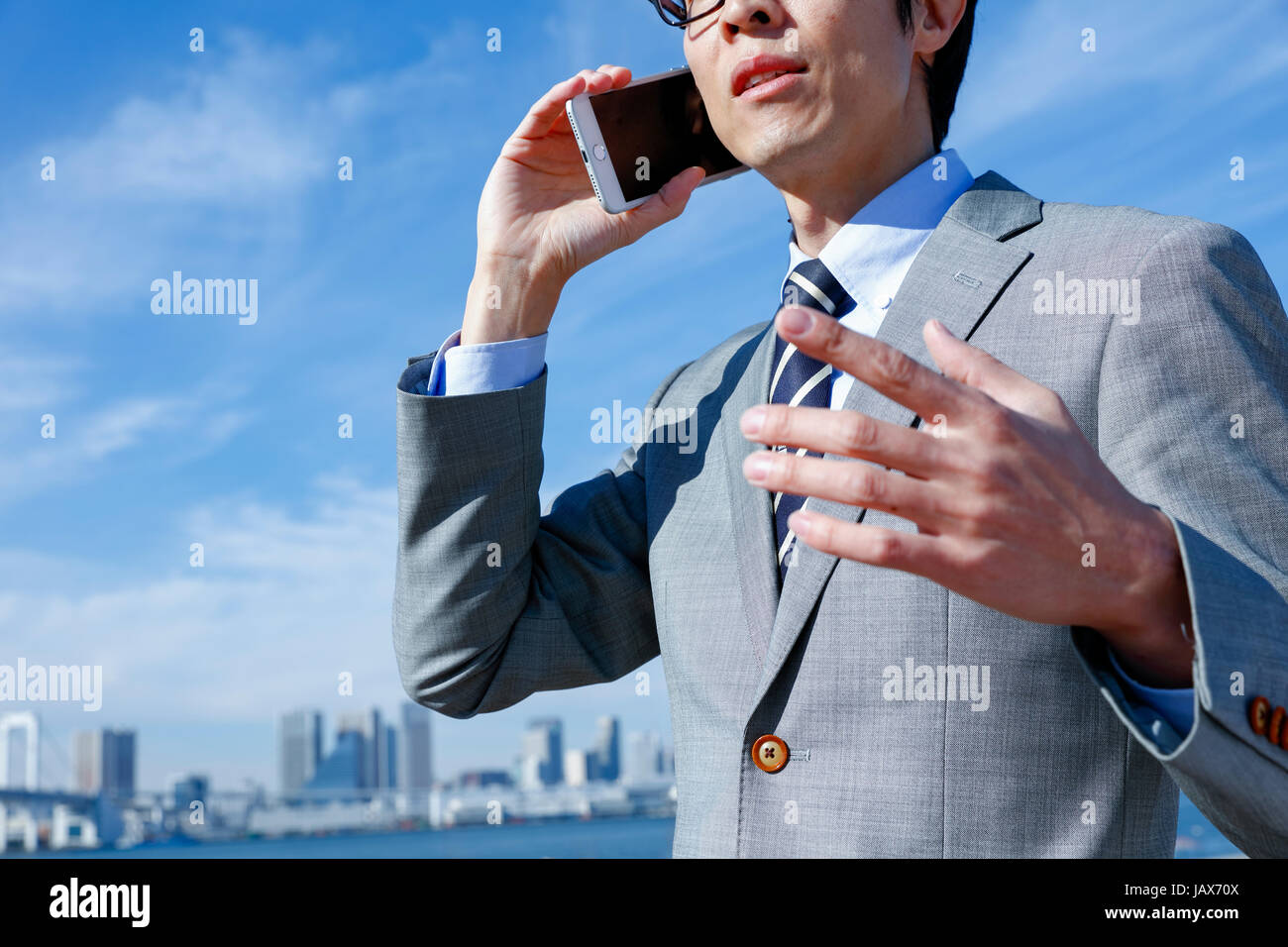 Japanese businessman on the phone downtown Tokyo, Japan Stock Photo - Alamy