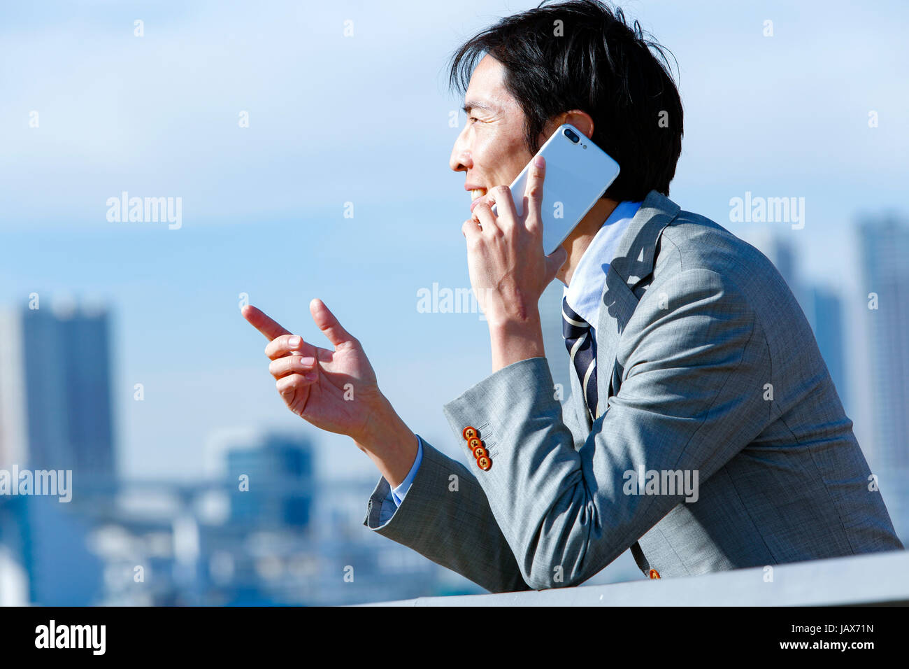 Japanese businessman on the phone downtown Tokyo, Japan Stock Photo - Alamy