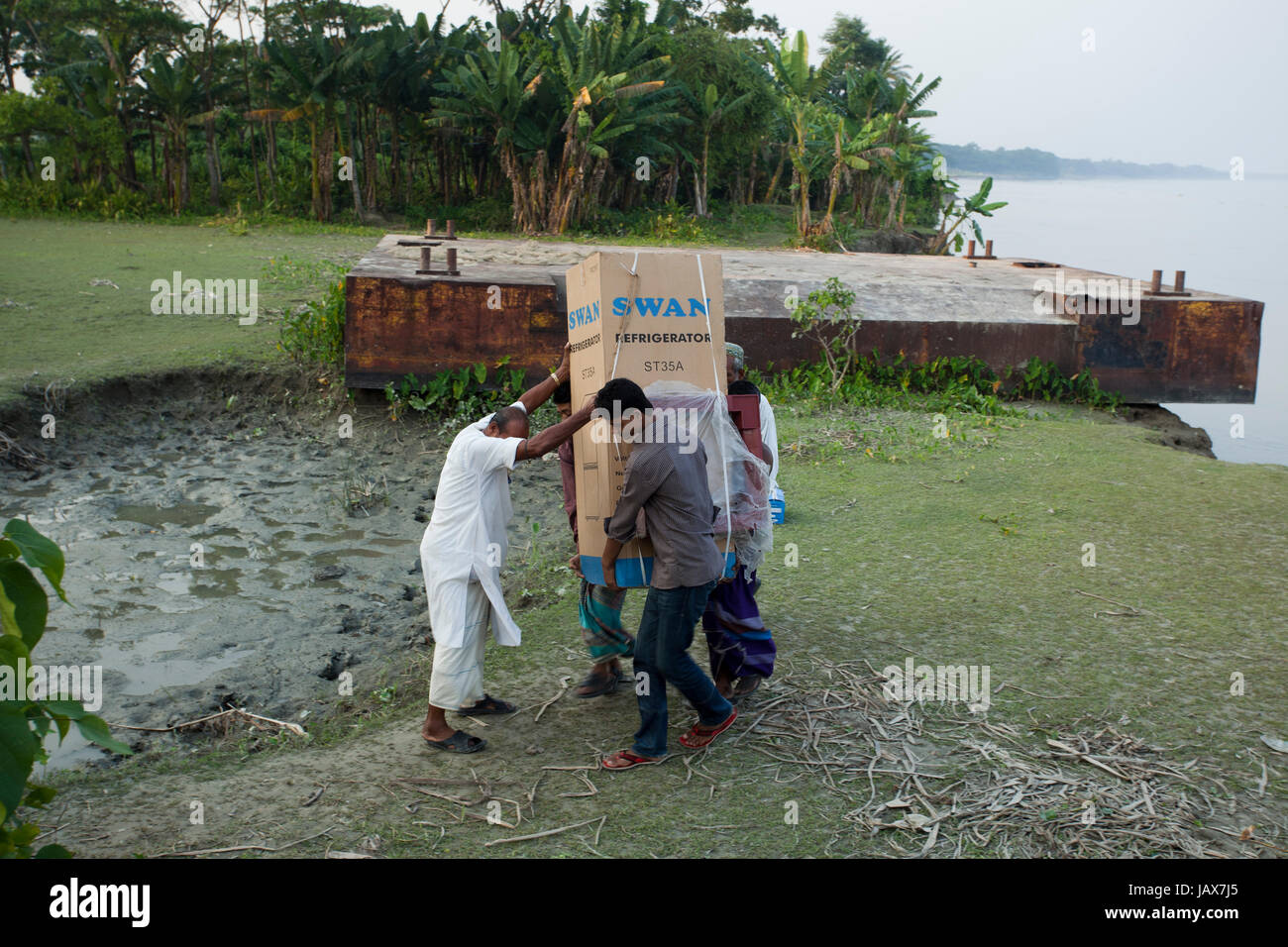 Rural Men carrying a refrigerator. Jhalakati, Bangladesh Stock Photo ...