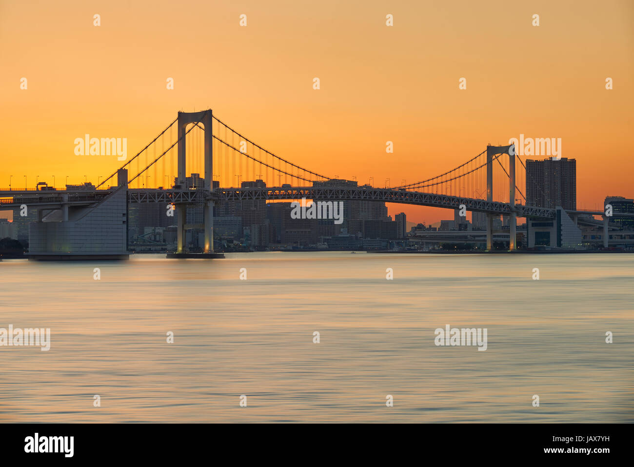 Long exposure shot of Rainbow Bridge at sunset, Tokyo, Japan Stock ...