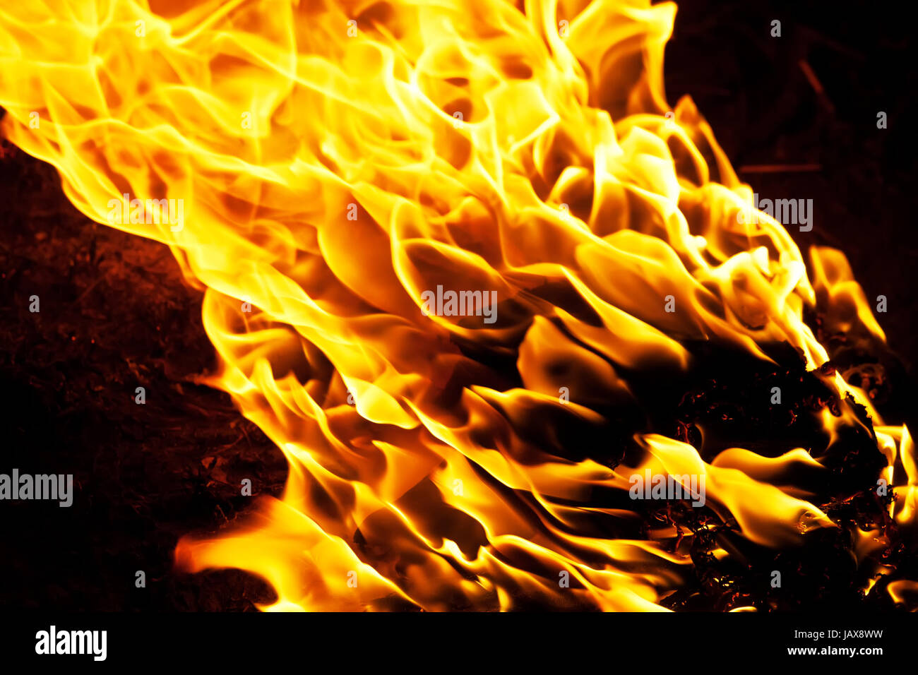Beautiful yellow and orange hot fire on black background Stock Photo ...