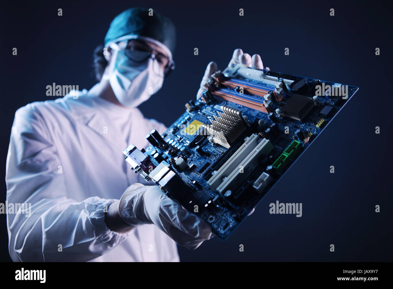 Computer engineer determines the main board problem Stock Photo - Alamy