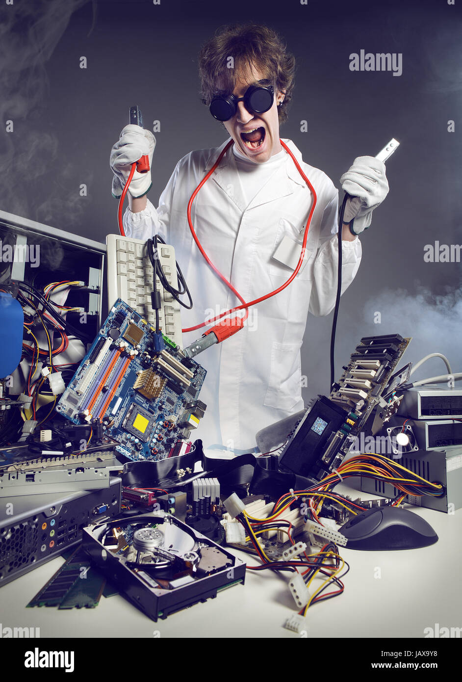 Crazy computer technician is trying to repair a computer Stock Photo ...