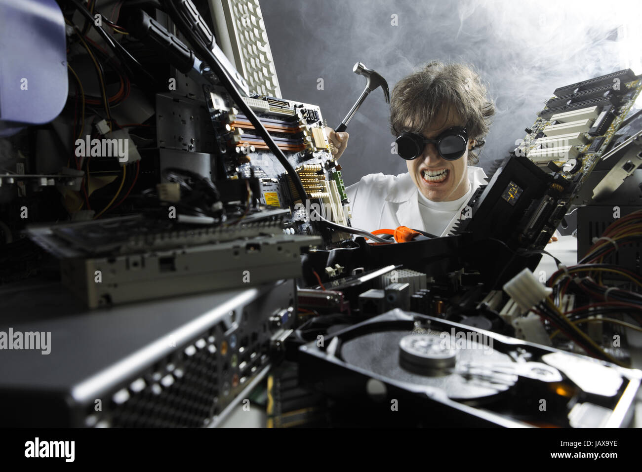Crazy computer technician is trying to repair a computer Stock Photo ...