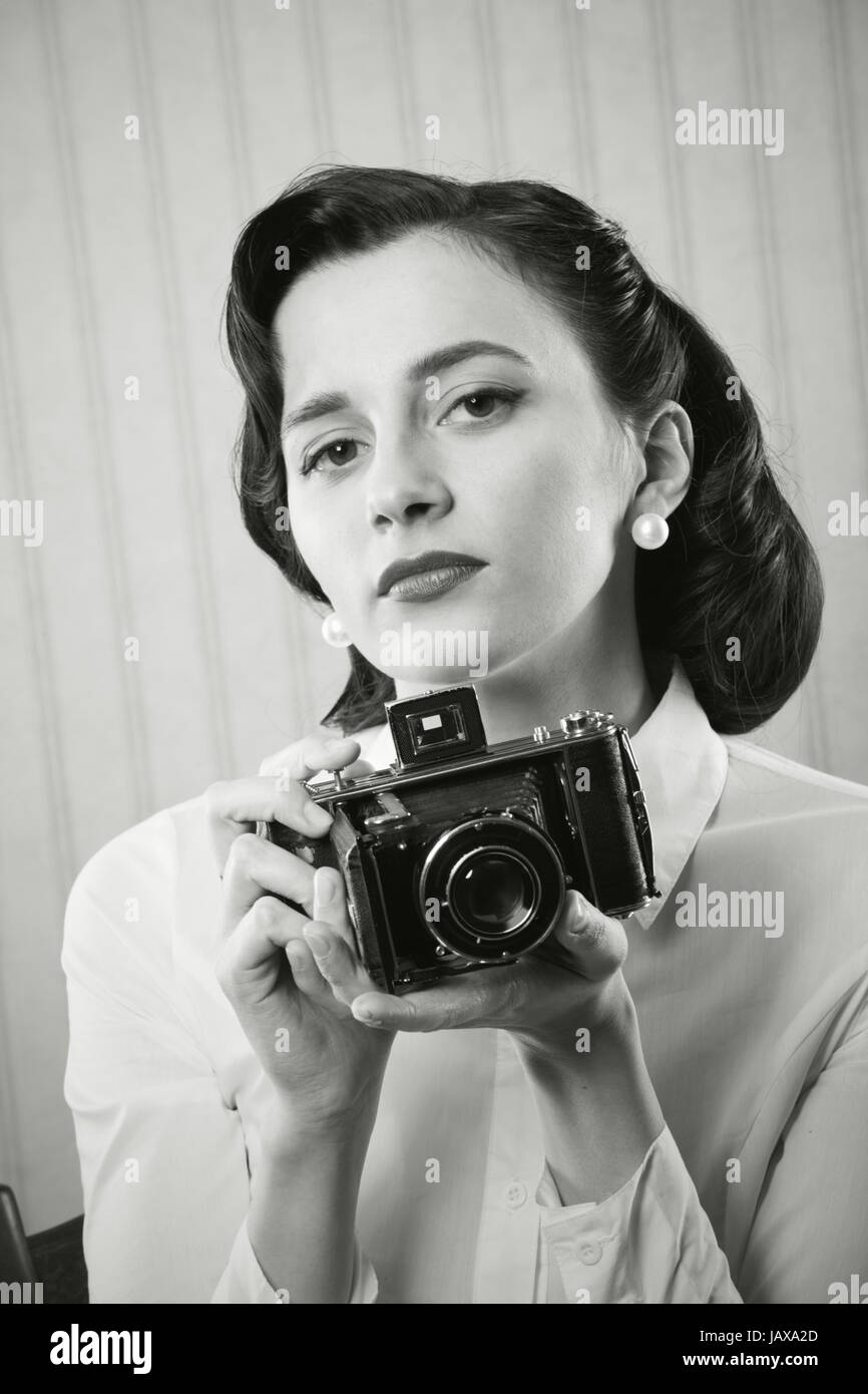 Beautiful business woman with a old camera Stock Photo - Alamy