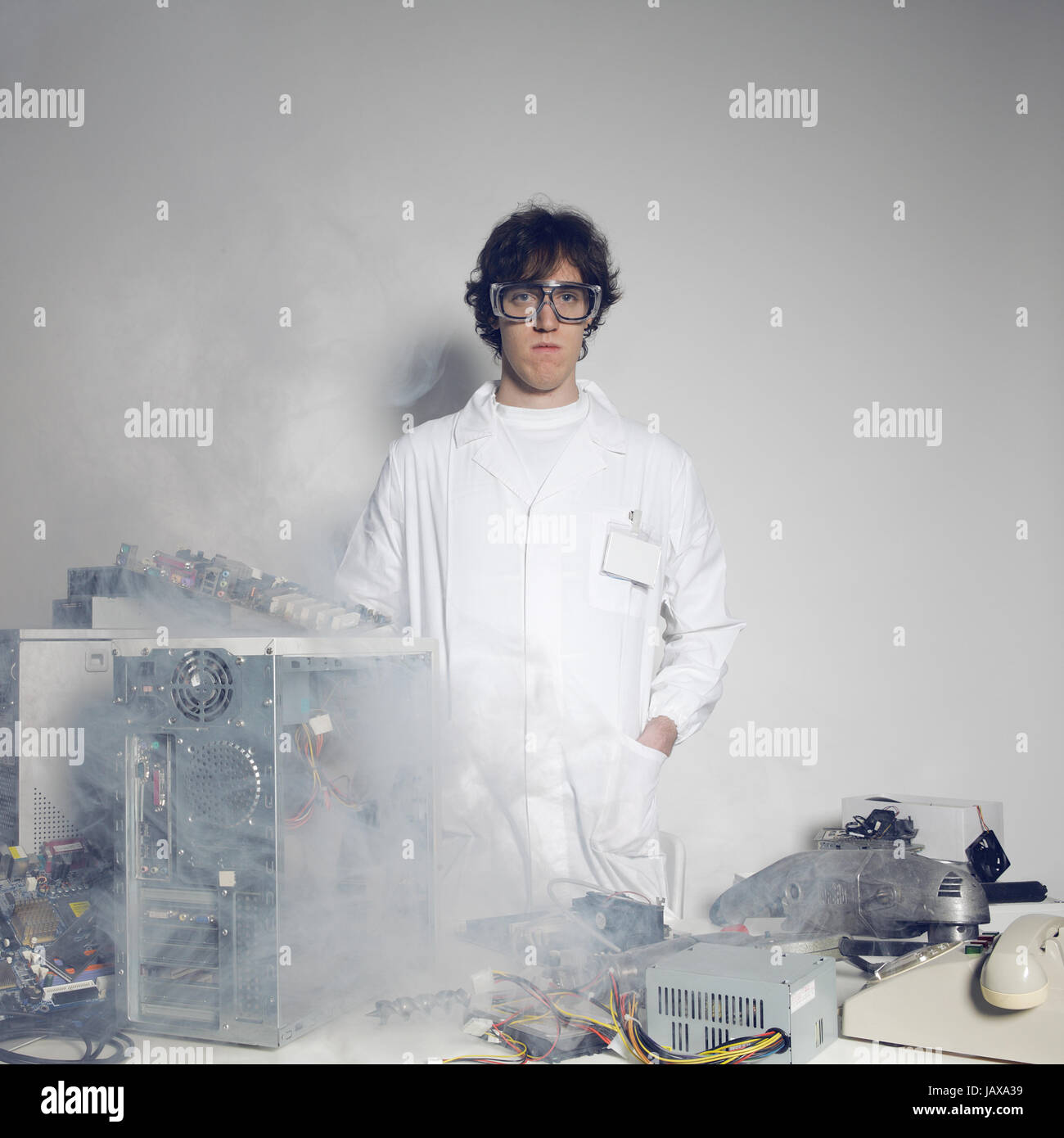 Portrait of a Computer technician with a computer destroyed Stock Photo ...