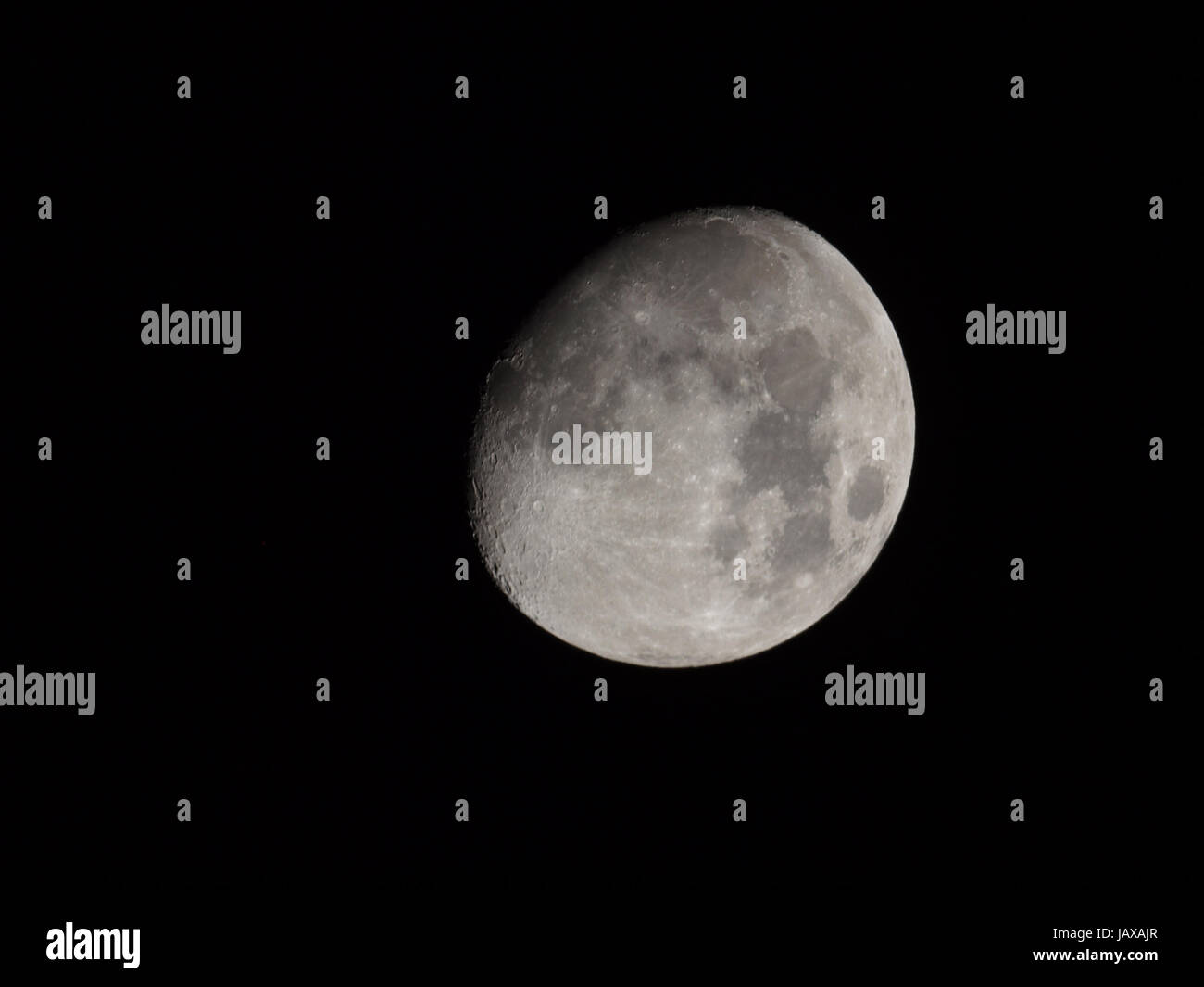 Near full moon seen with a telescope Stock Photo - Alamy