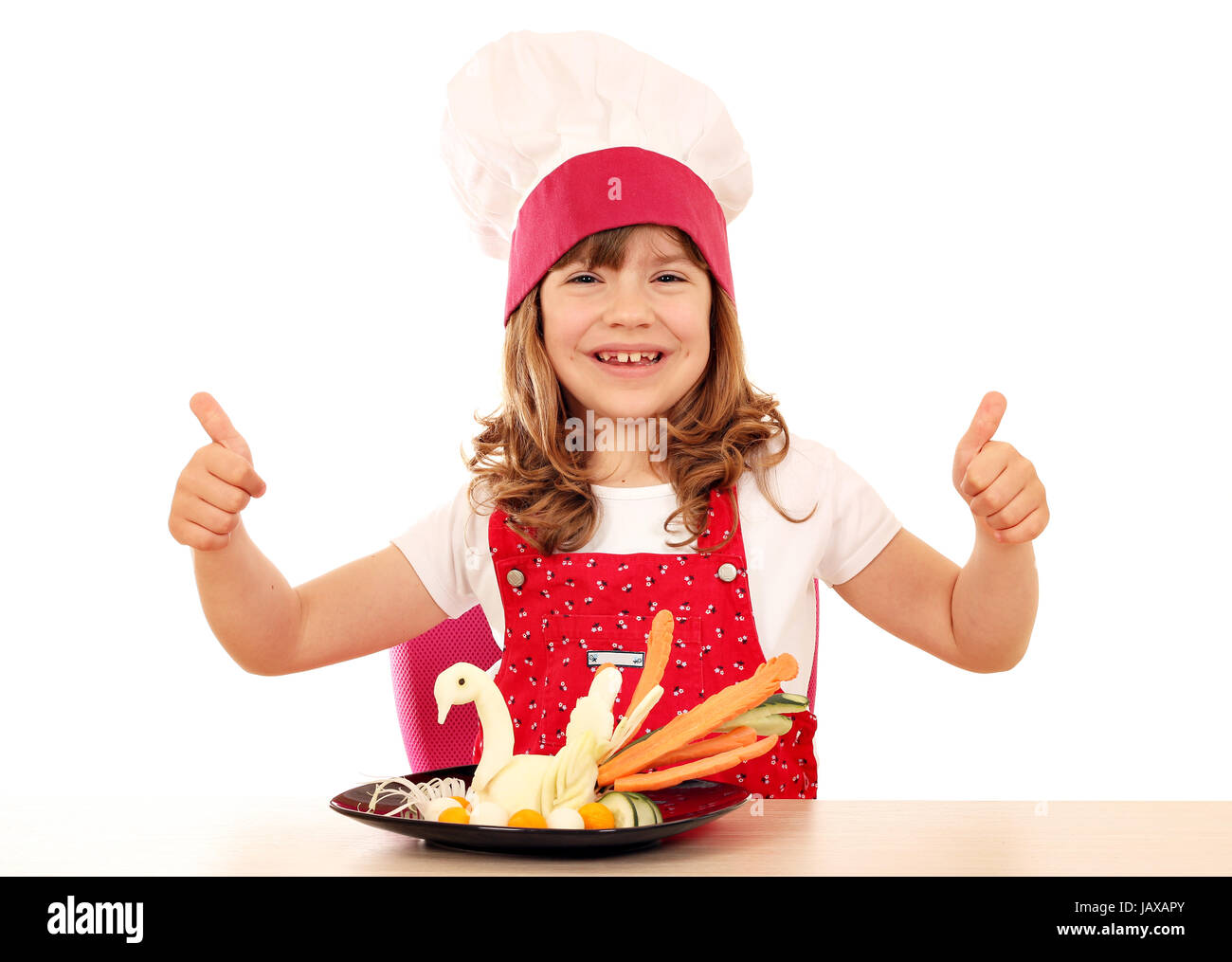 happy little girl cook with thumbs up and white swan decorated salad ...